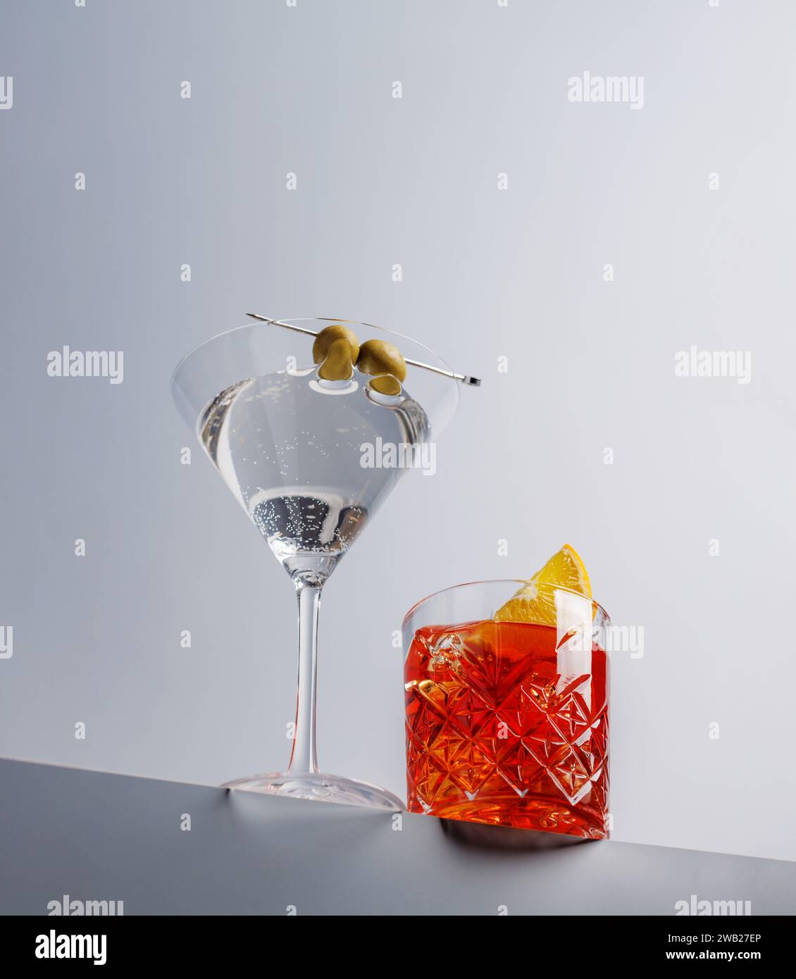 Cocktail delight: Vibrant drinks against a grey background with copy ...