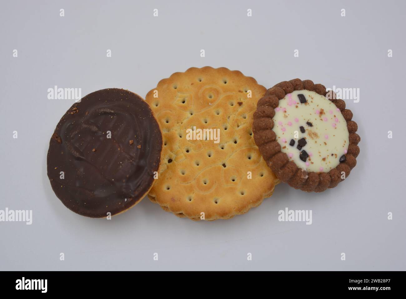 Branded, factory-made biscuits of various types are arranged in a white ...