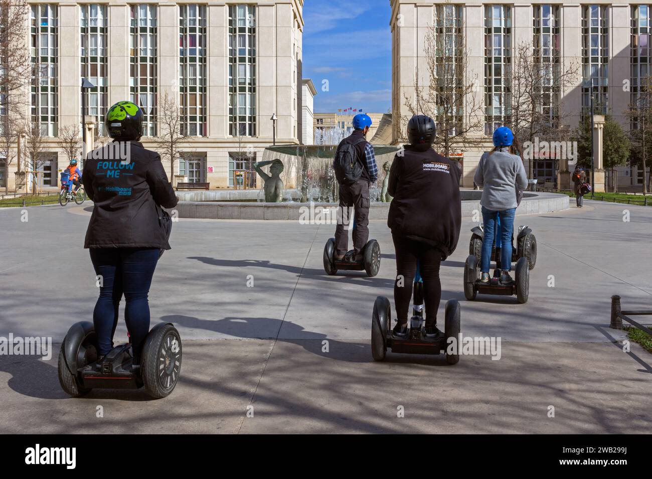 Group of tourists visiting the city on Segways. Montpellier, Occitanie ...