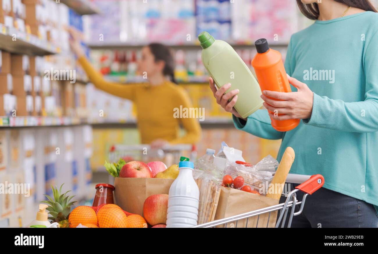 Woman grocery store comparing two hi-res stock photography and images ...