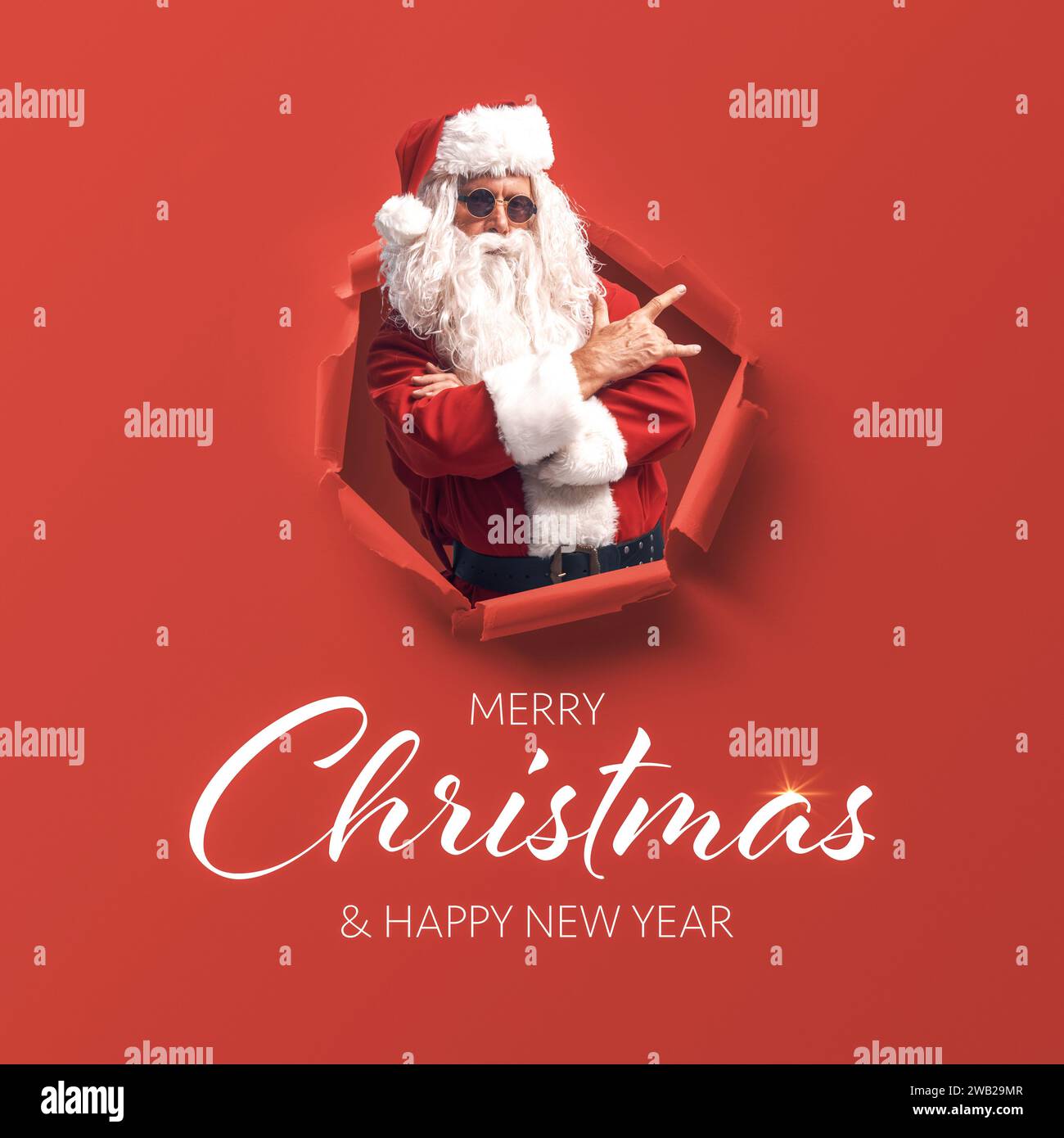 Unconventional Bad Santa Claus popping out of a hole in the paper and ...