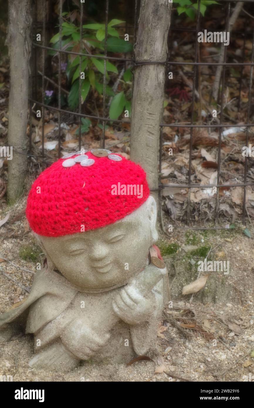 Statues in memory of unborn children on the island of Miyajima, near ...