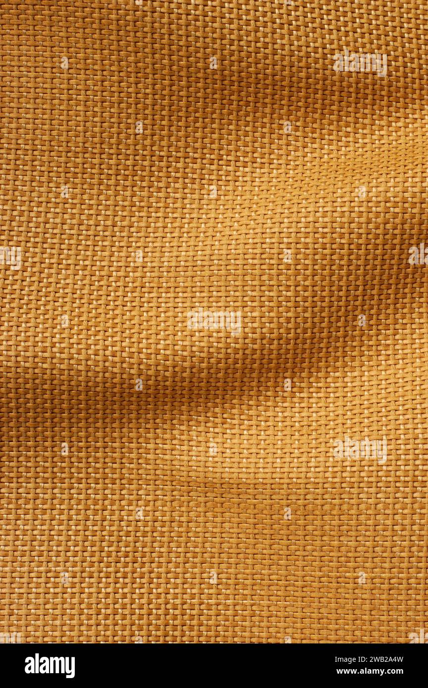 A vertical of a brown woven wavy fabric background Stock Photo - Alamy