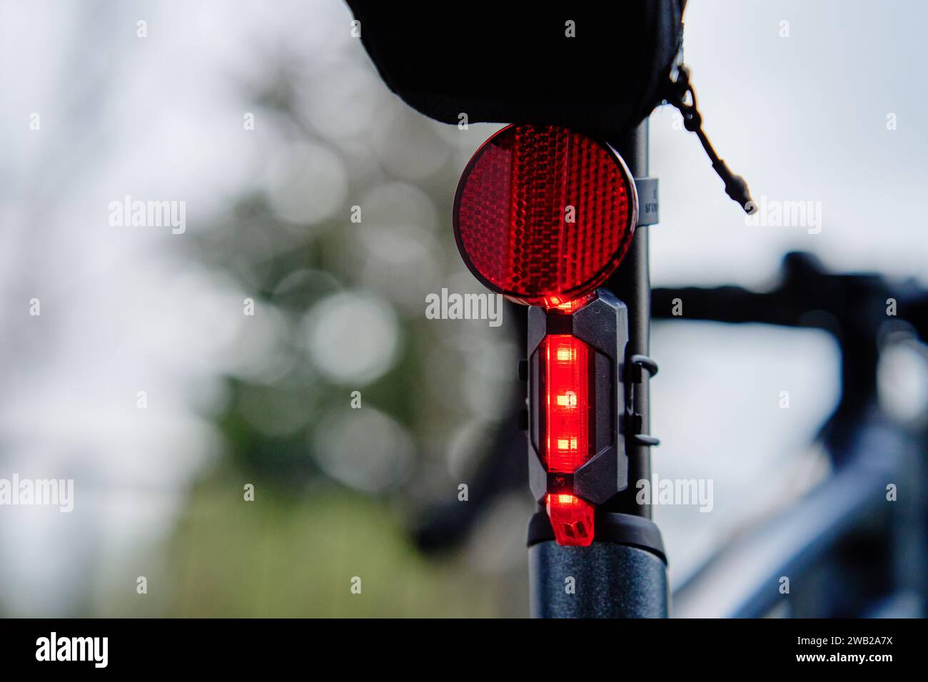 Glowing bicycle taillight. Red stop light for cyclist safety. Rear led ...