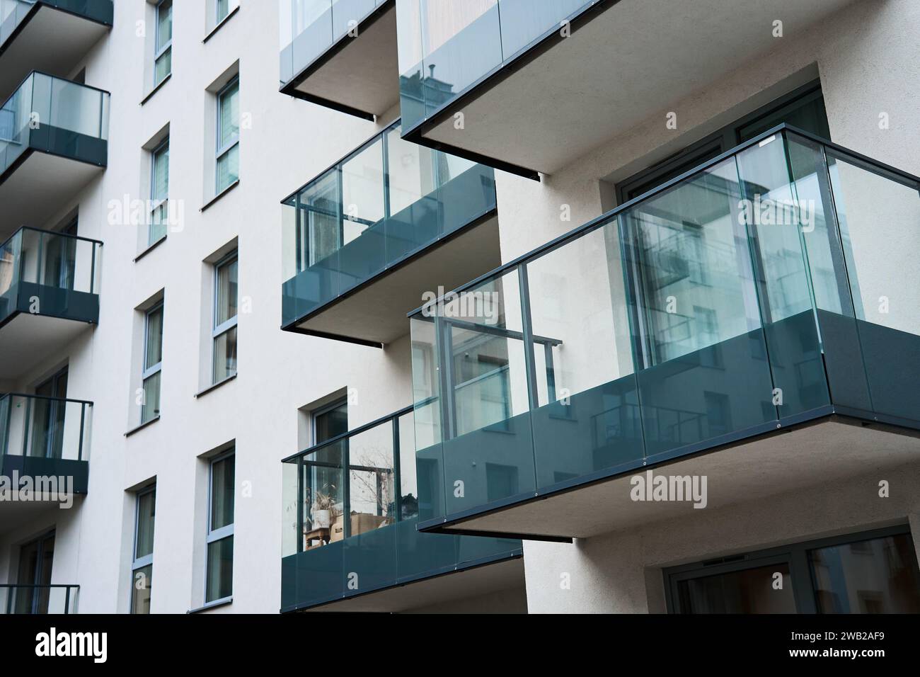 Residential building facade with balconies and windows. Modern city ...