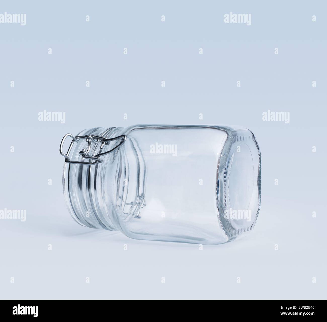 Empty clean clip-top glass jar lying on a side, food storage concept ...