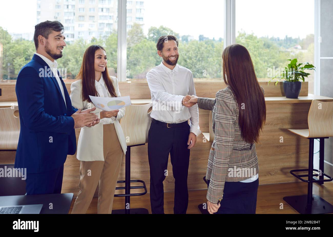 Positive Business People Engaging in Handshake at the Office Stock ...