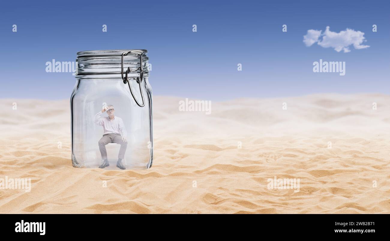 Man suffering from the heat and sweating, he is trapped inside a glass ...