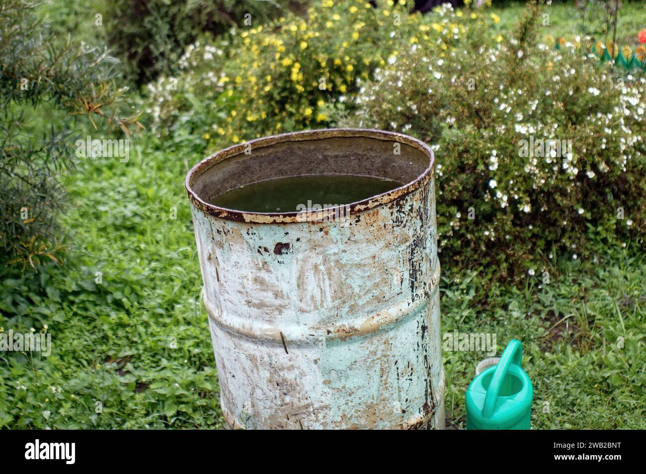 Old metal barrel with water in the village, Russia Stock Photo - Alamy