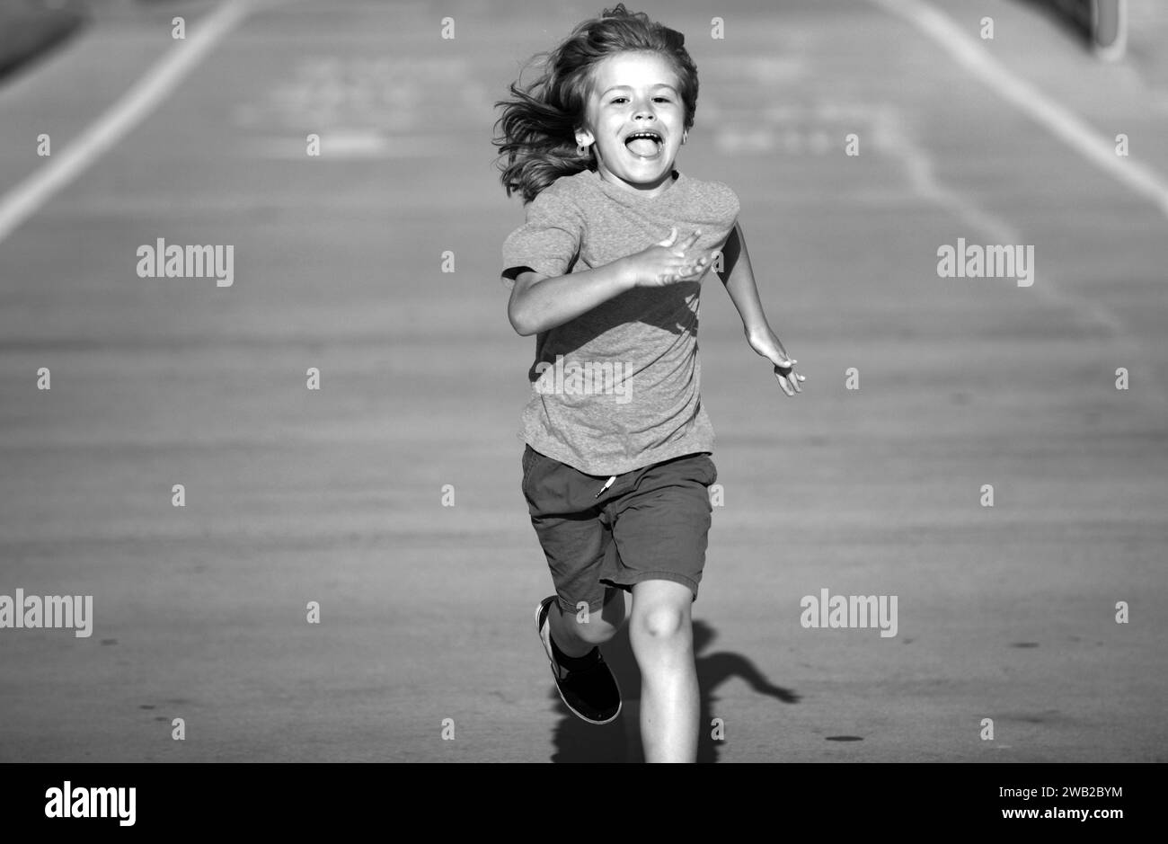 Cheerful boy running to school. Kids run race Stock Photo - Alamy