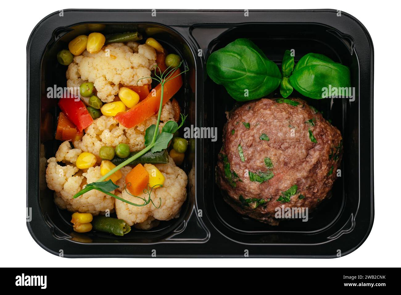 beef patty with side dish in lunch box on white background Stock Photo ...