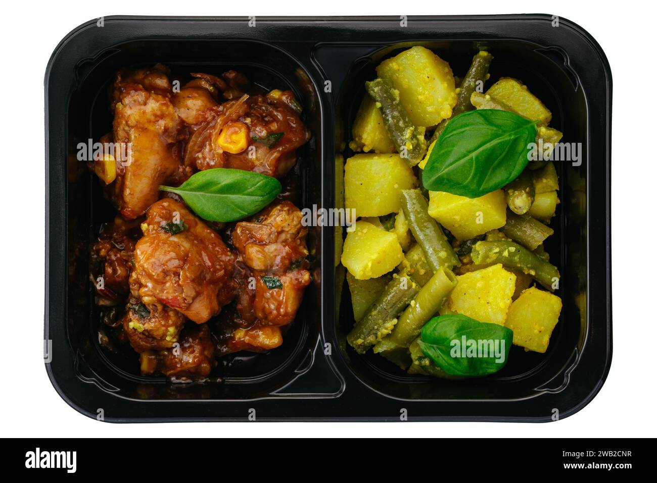 boiled potatoes with chicken in lunch box on white background Stock ...
