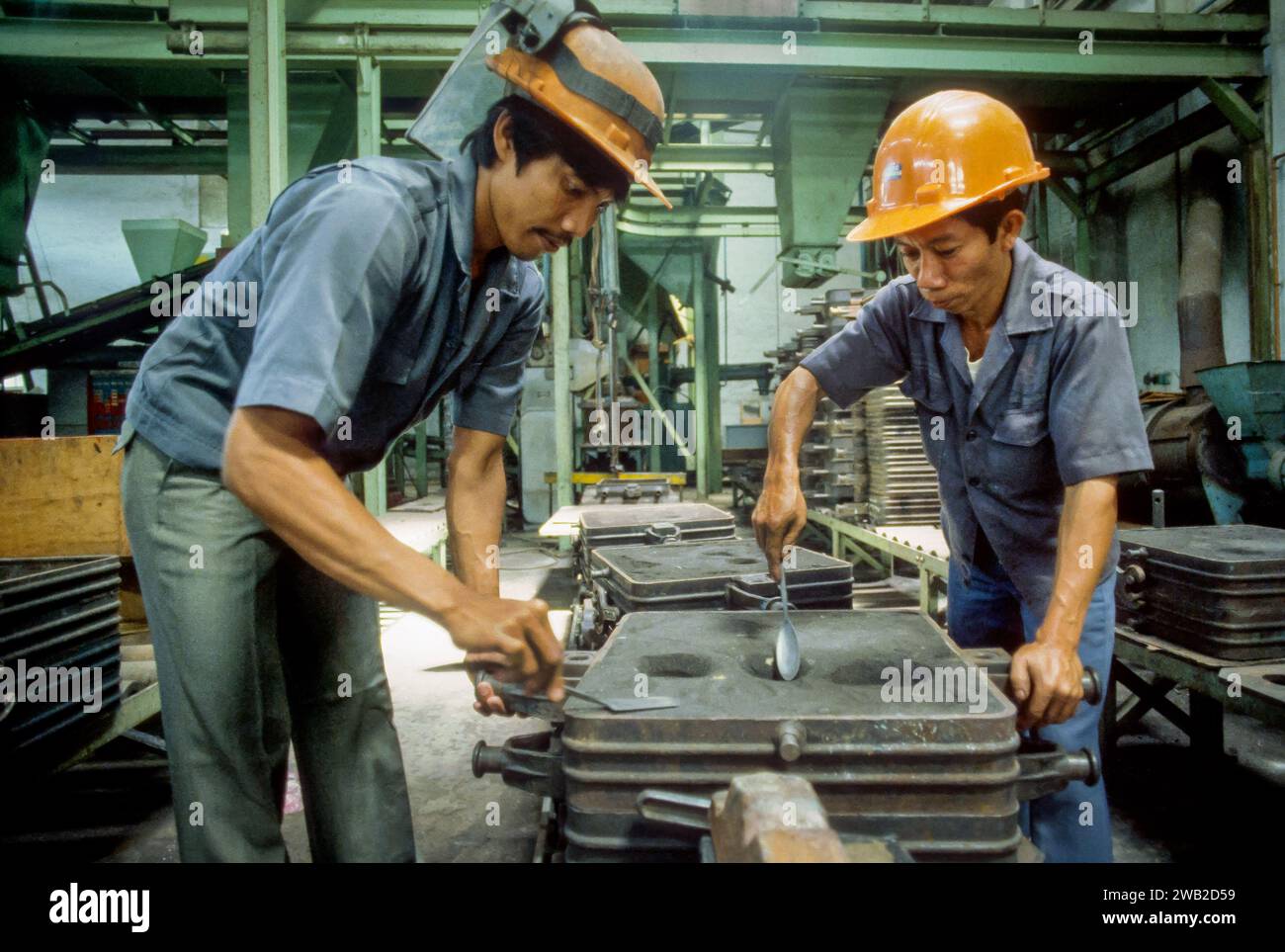 Indonesia, Bandung. Two men working in a steelfactory Stock Photo - Alamy