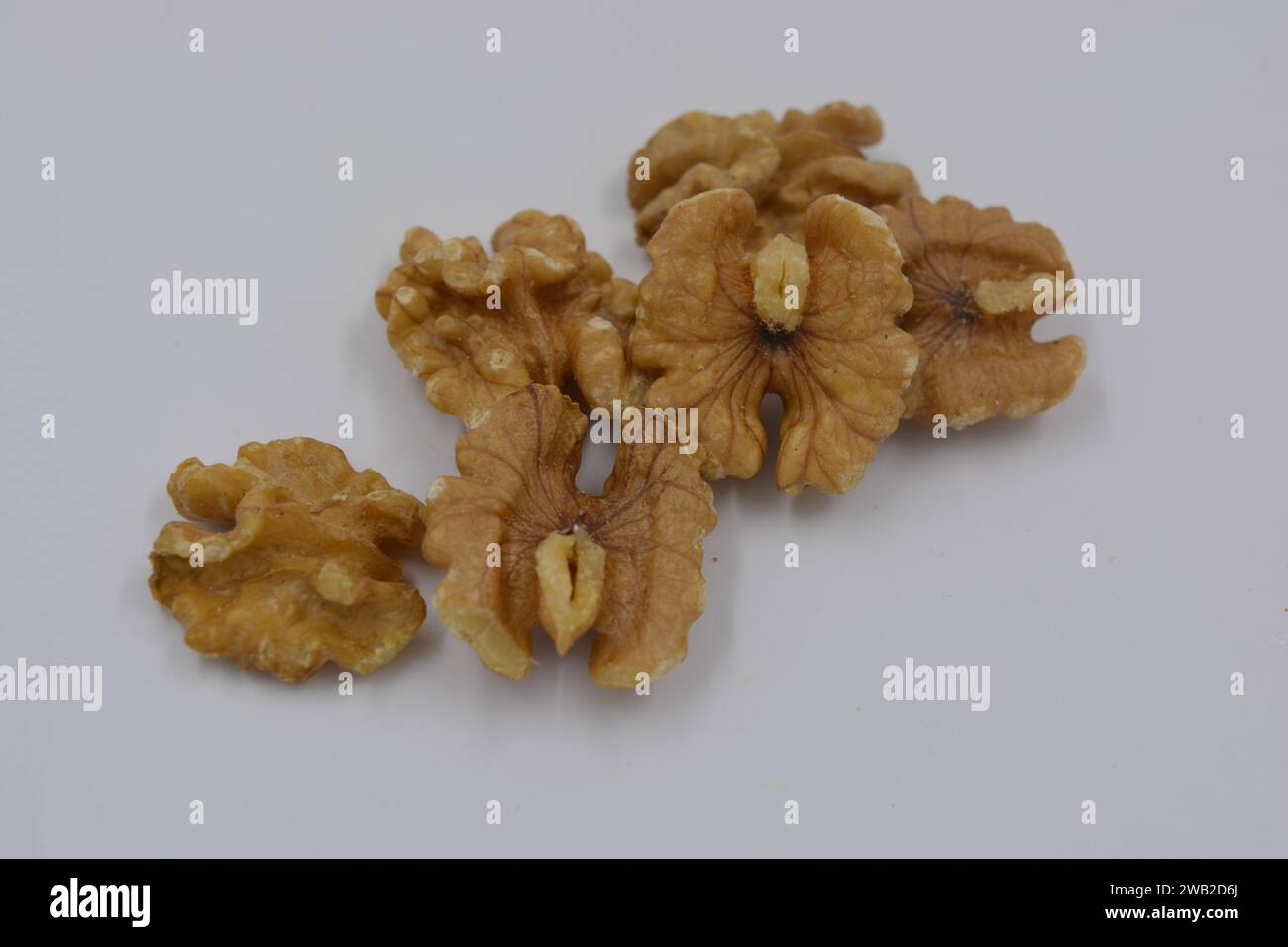 Healthy food, natural nuts, walnuts arranged on a white background ...