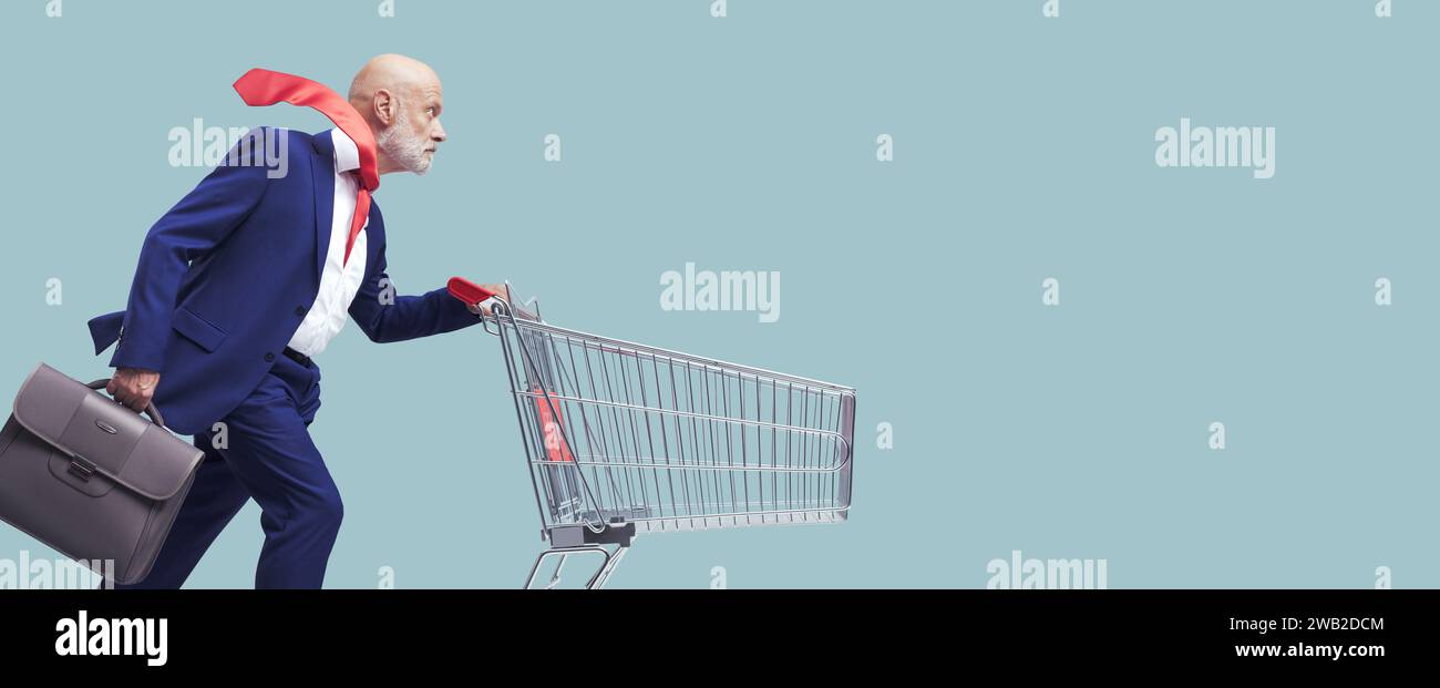 Fast businessman running and pushing a supermarket shopping cart Stock ...