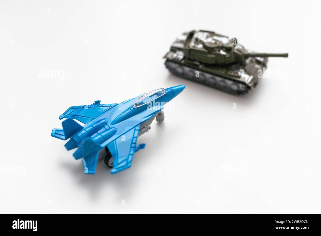 The image shows models of tanks and fighter jets on a white background ...