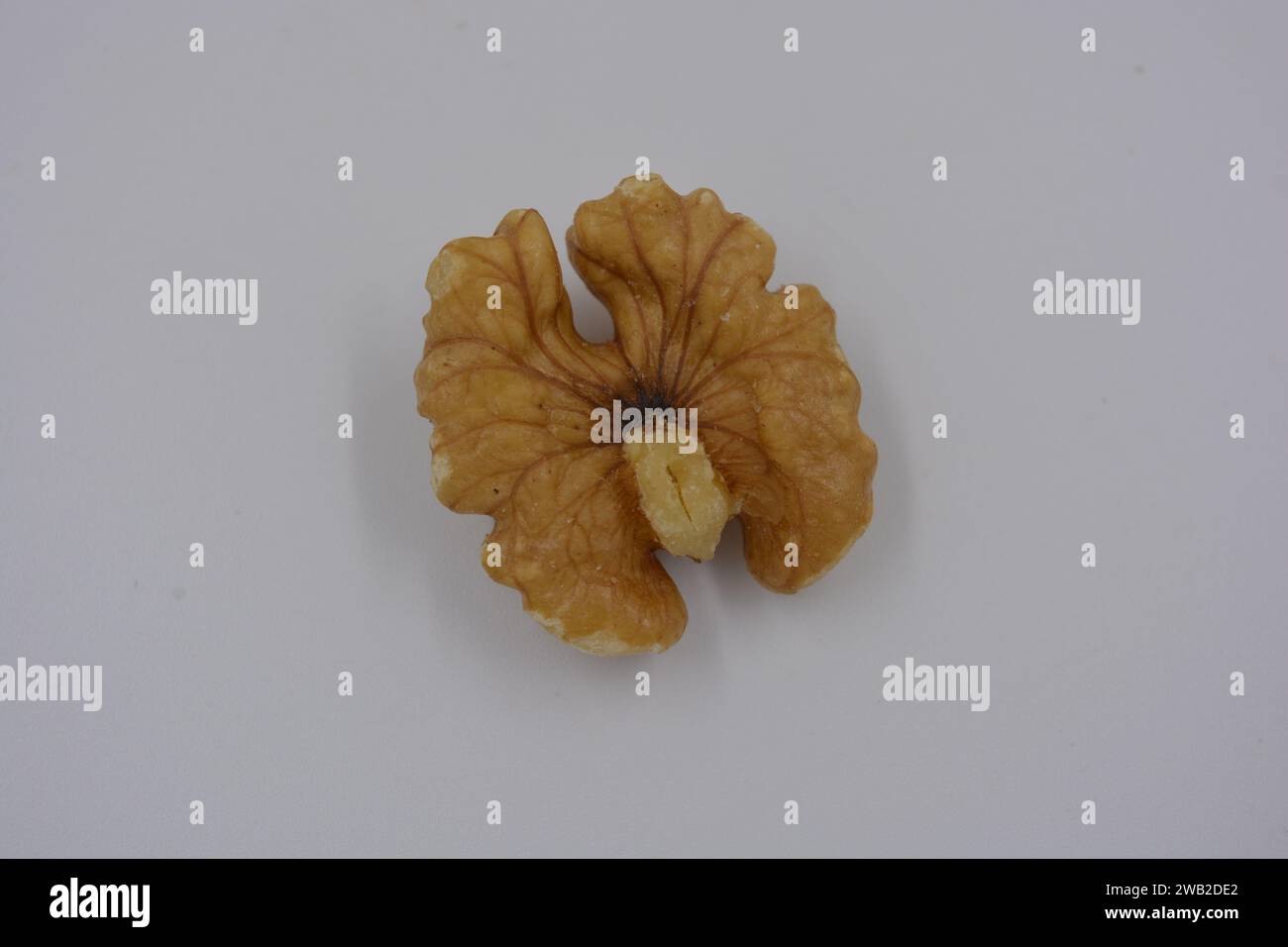 Healthy food, natural nuts, walnuts arranged on a white background ...