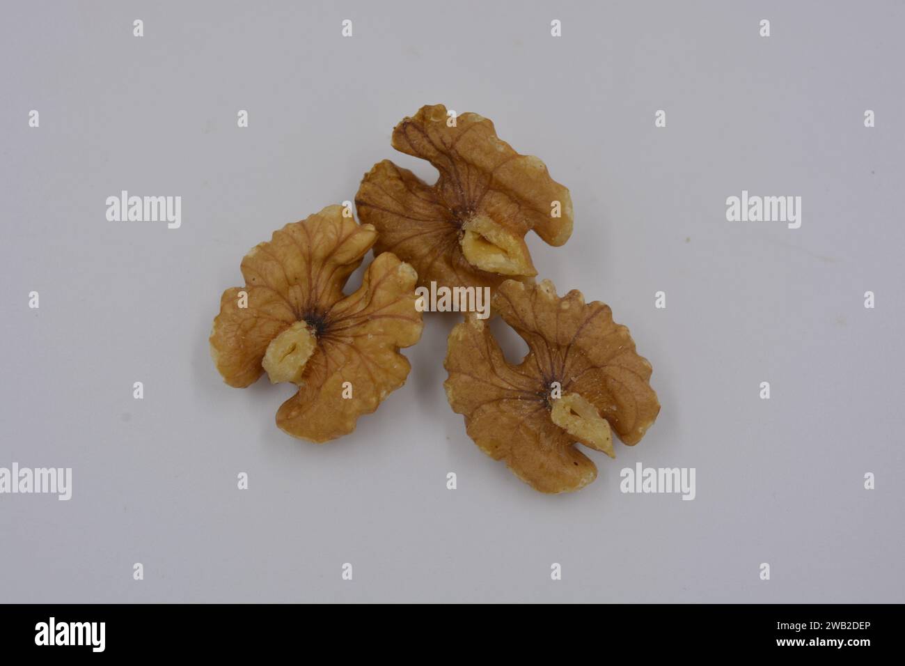 Healthy food, natural nuts, walnuts arranged on a white background ...