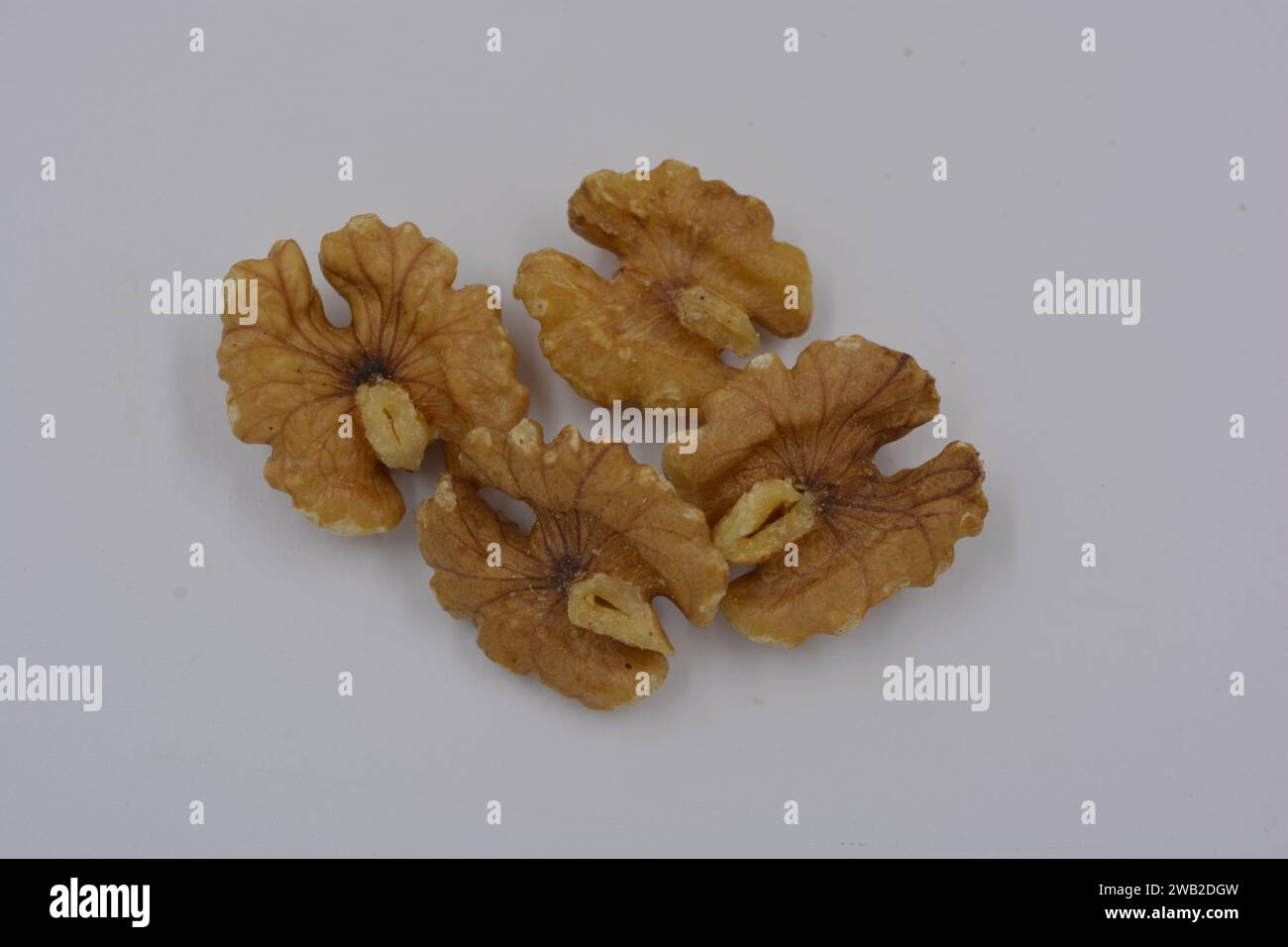 Healthy food, natural nuts, walnuts arranged on a white background ...