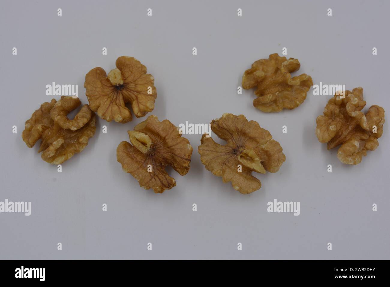 Healthy food, natural nuts, walnuts arranged on a white background ...