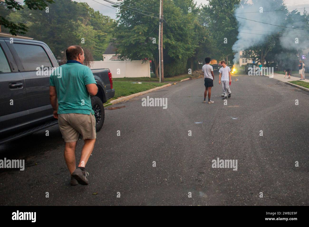 Neighbors getting together on holiday block party Stock Photo - Alamy