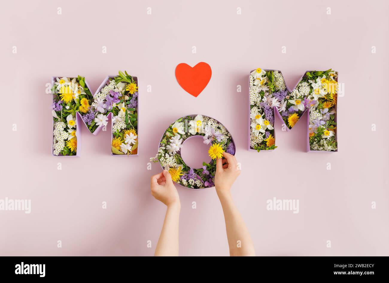 Boxes In Shape Of MOM Word full of flowers. Mother’s Day concept Stock ...