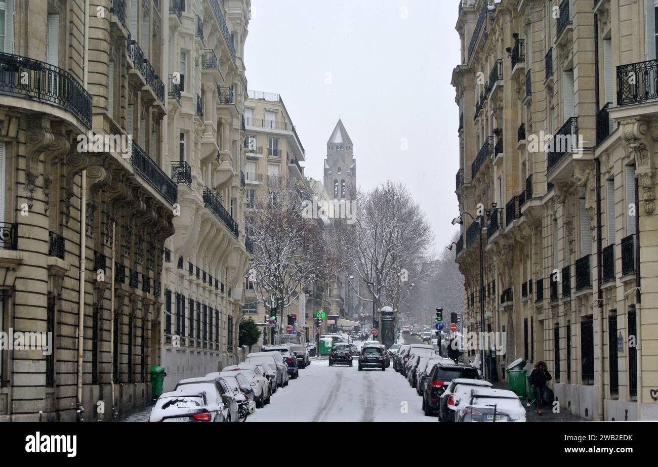 Unexpected snow in Paris. Frere Perrier street and cars covered in snow ...