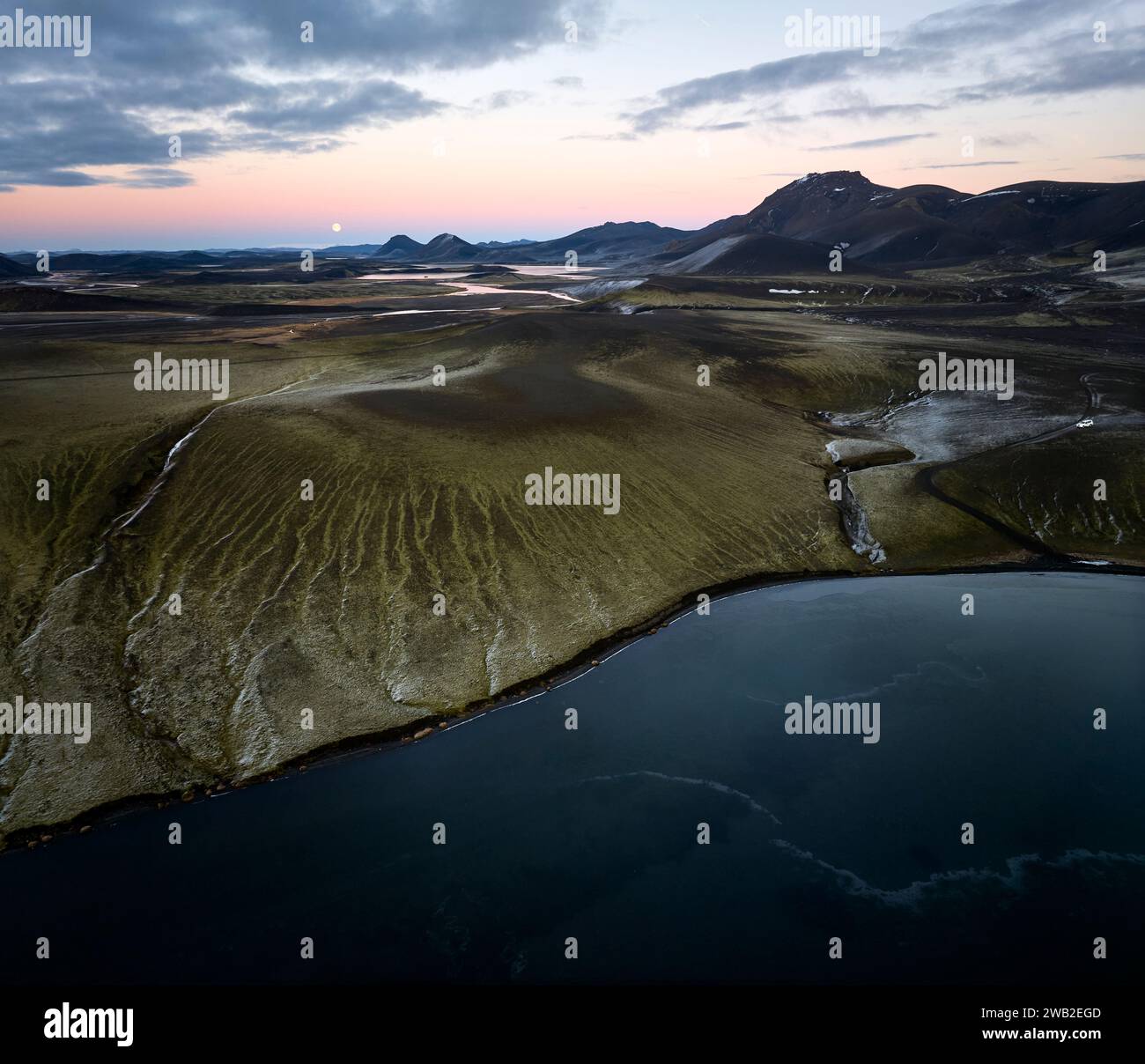 Drone view of sunset and landscape with lake Stock Photo - Alamy