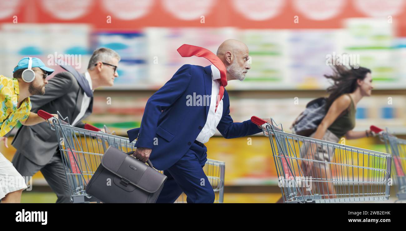 Fast people pushing shopping carts at the supermarket, offers and sales ...