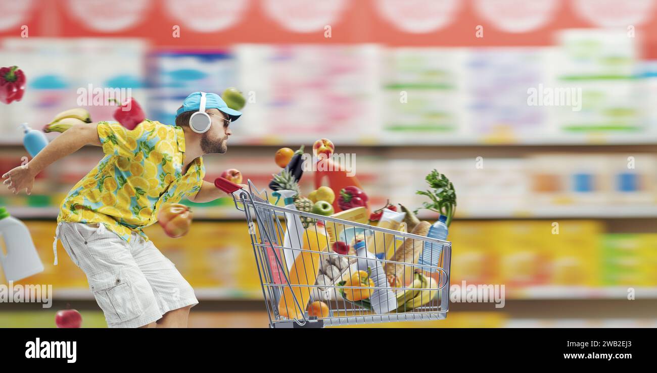 Cool guy running and pushing a supermarket trolley, grocery shopping ...