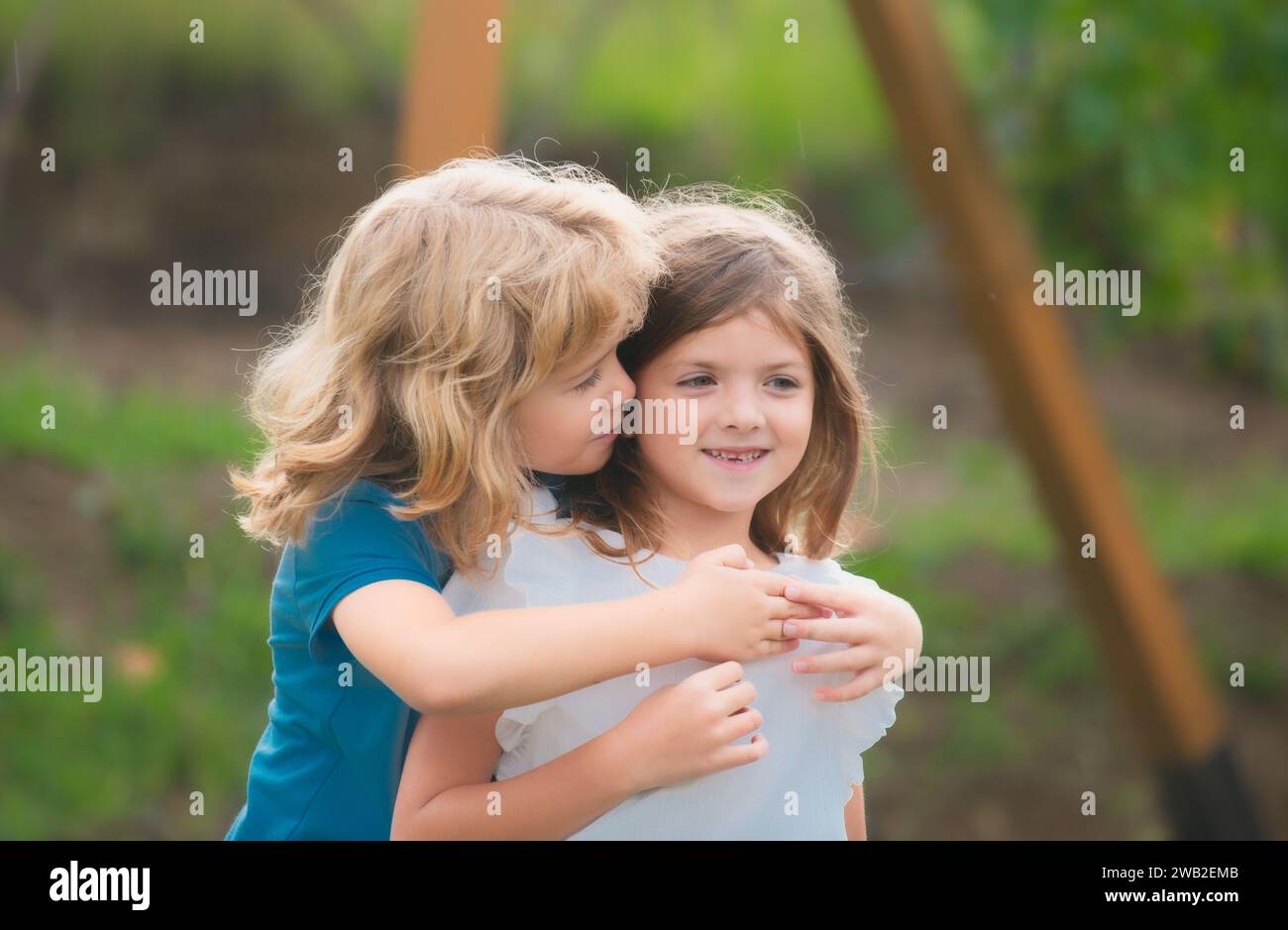 Little boy hugging shy girl, toddler boy embracing depressed little ...