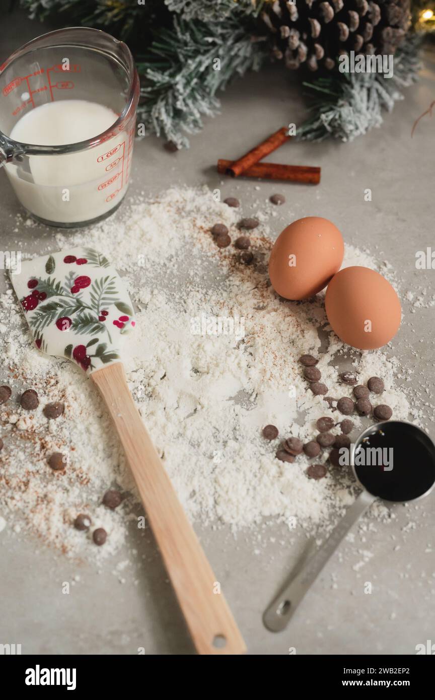Holiday baking ingredients on a kitchen countertop with holiday decor ...