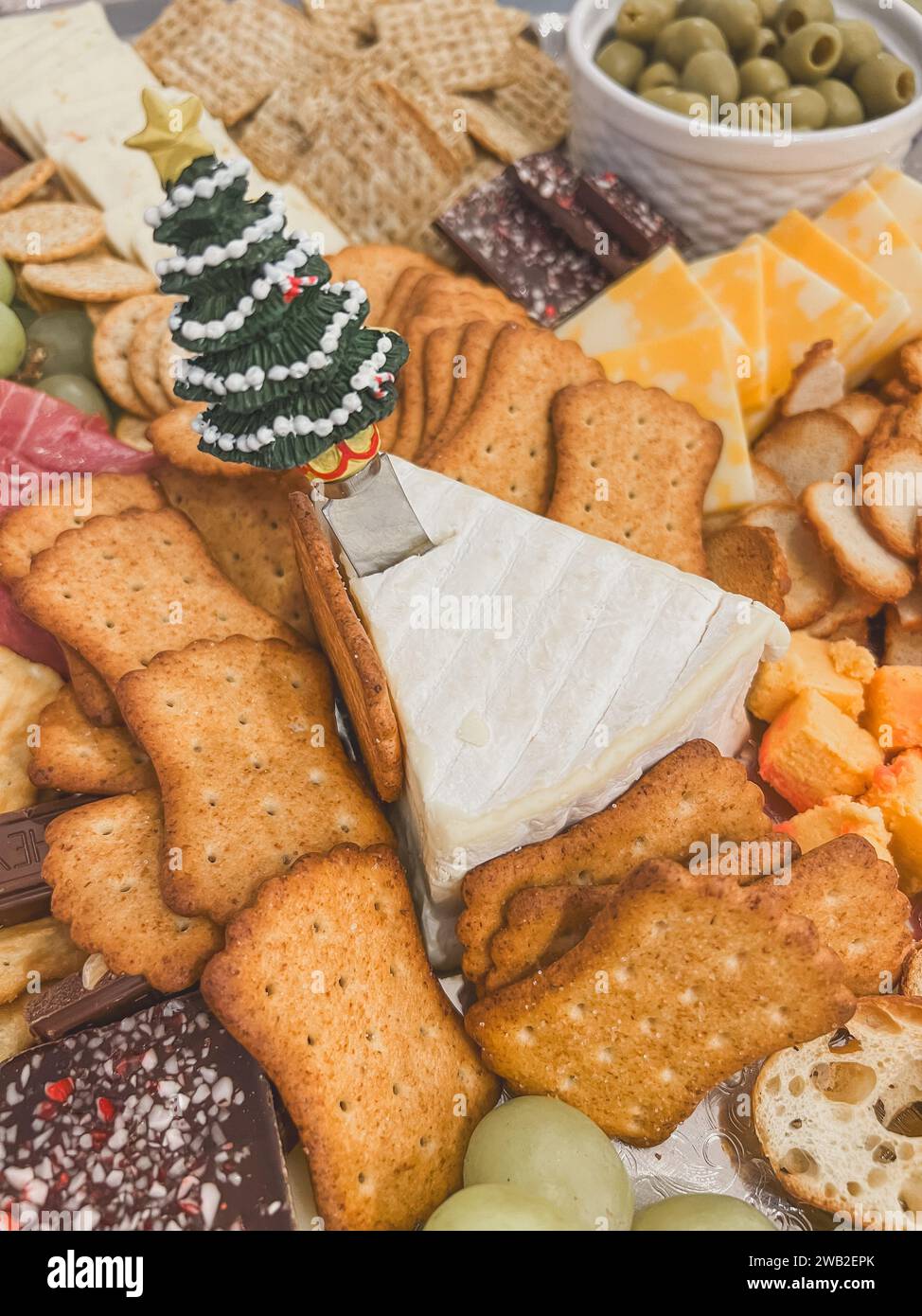 christmas Tree Cheese Knife in Brie on Charcuterie Board Stock Photo ...