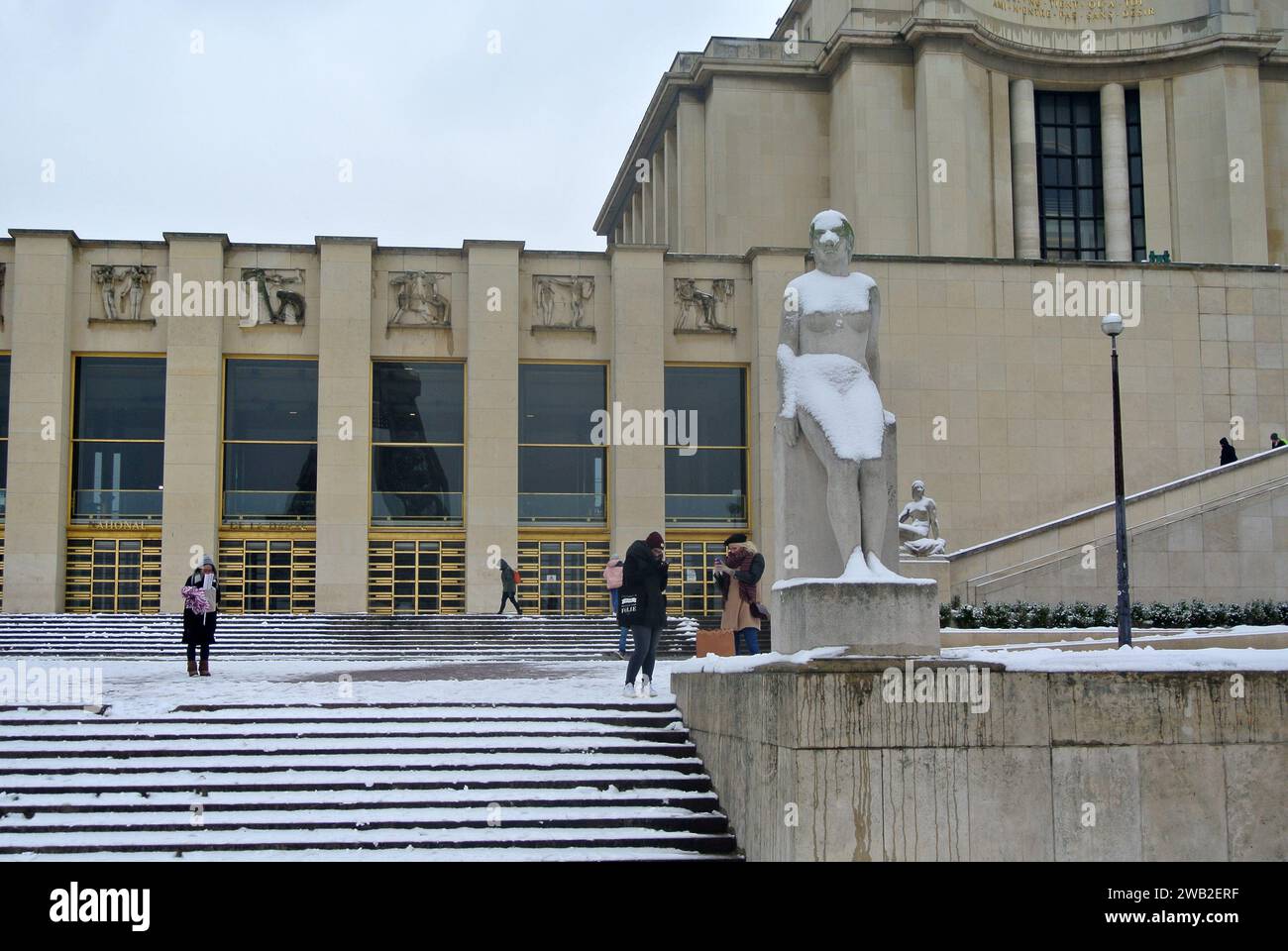 Unexpected snow in Paris. Trocadero Garden with stone sculptures and ...