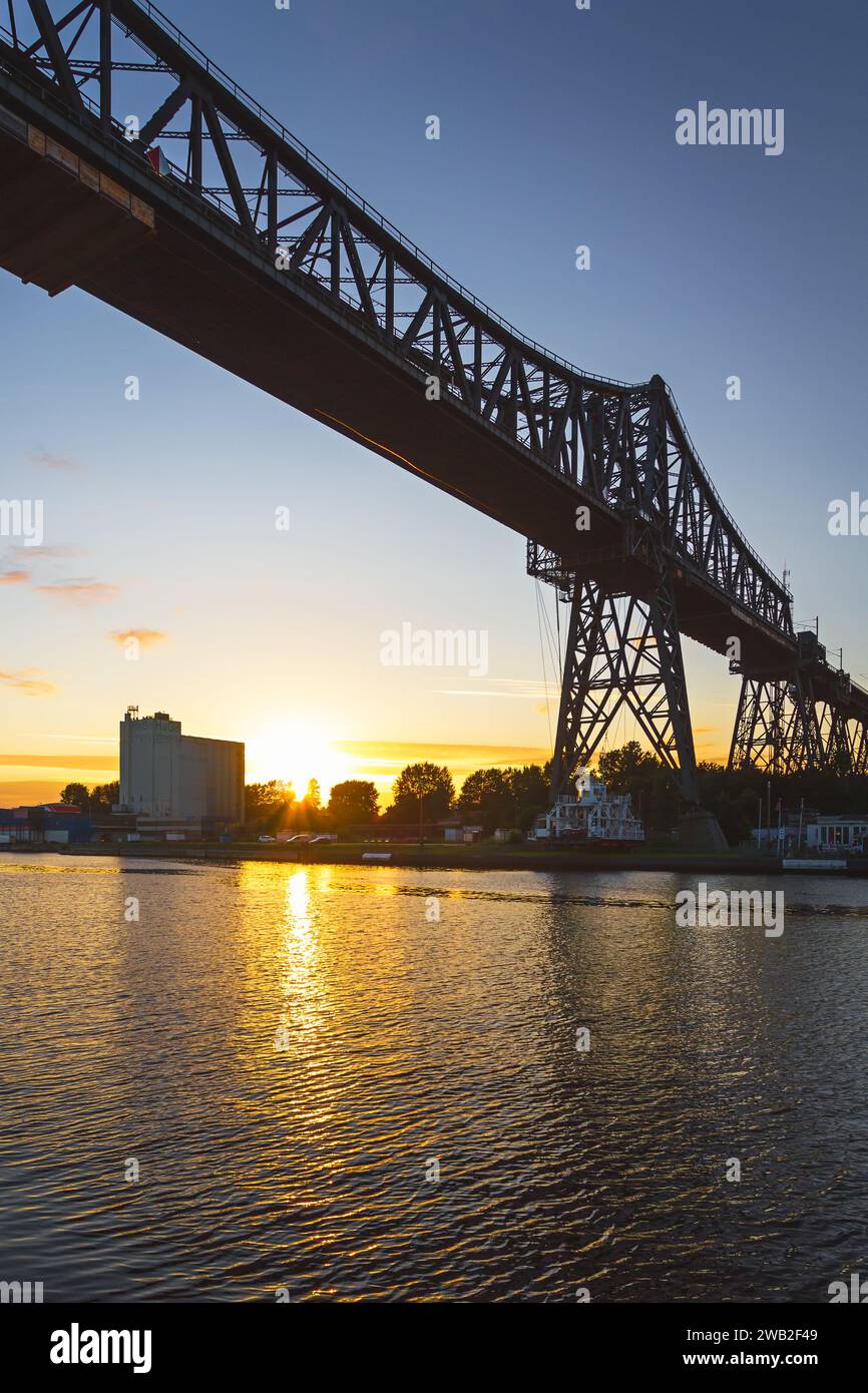 A picturesque scene of a bridge spanning a tranquil body of water ...
