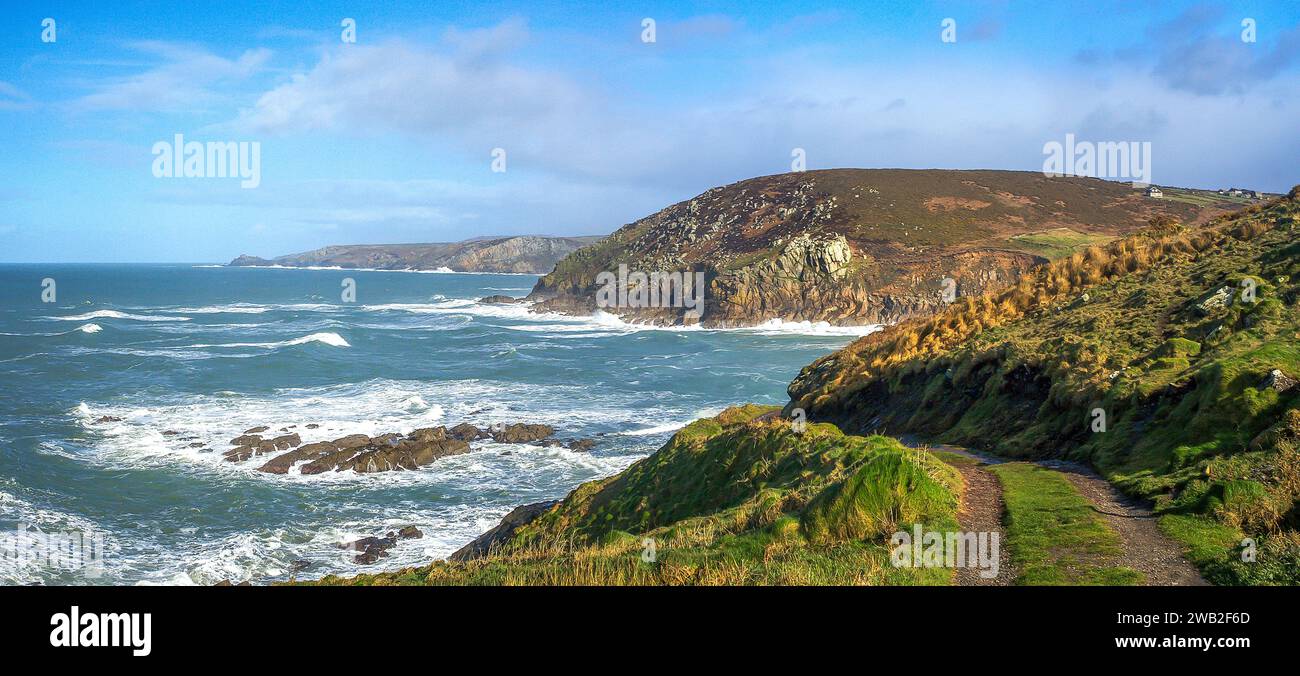 A scenic coastal pathway leading through a grassy landscape with ...
