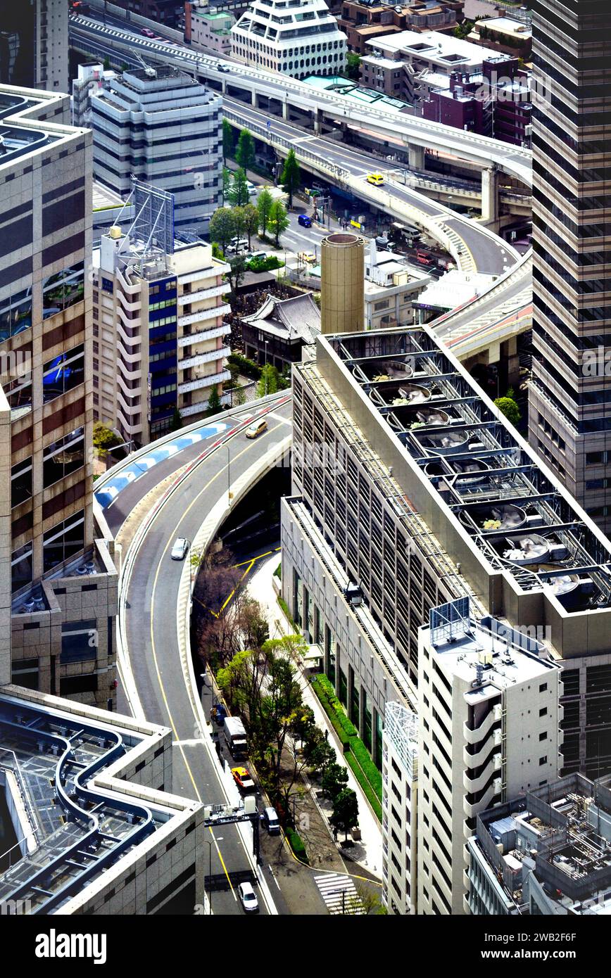 Aerial view of Tokyo cityscape featuring a major freeway running ...