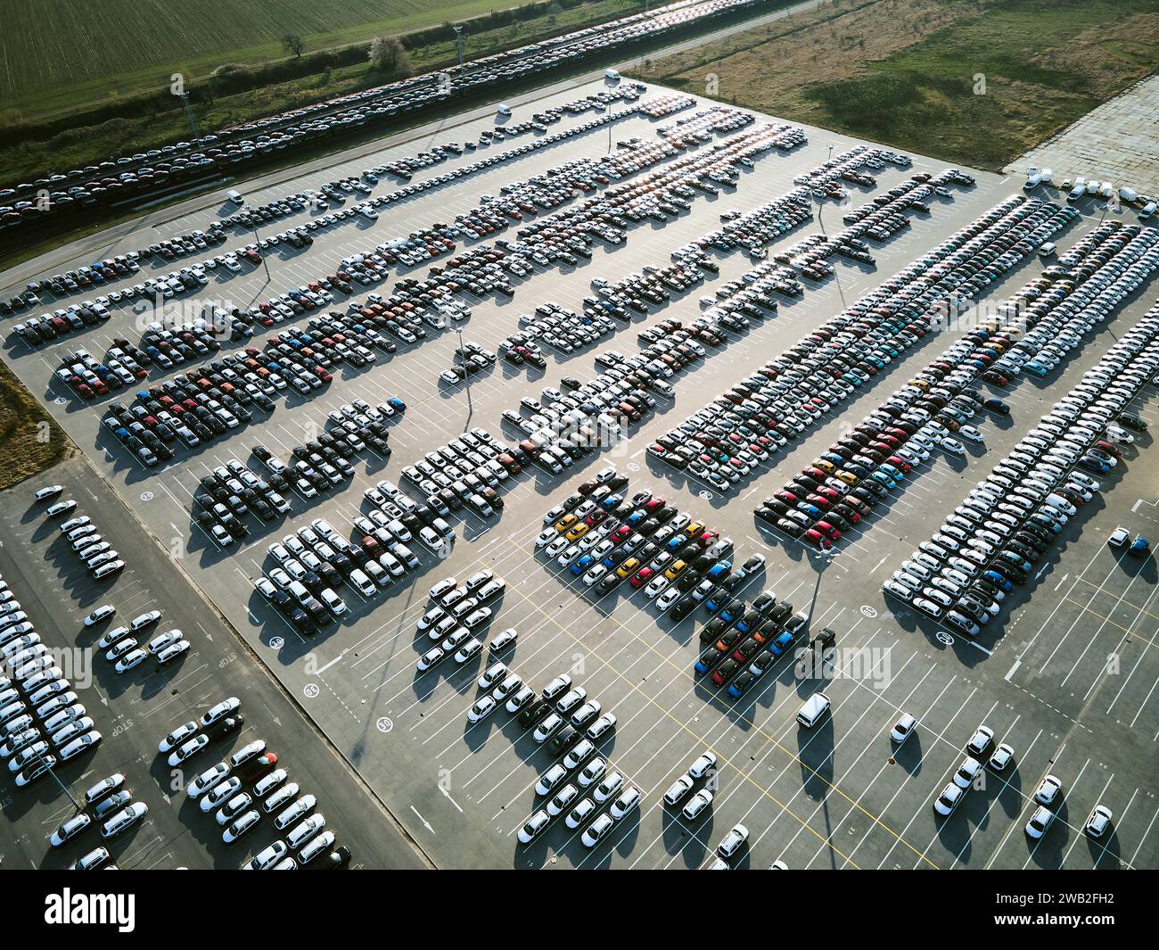 Aerial view of a massive parking lot at a car manufacturing facility ...