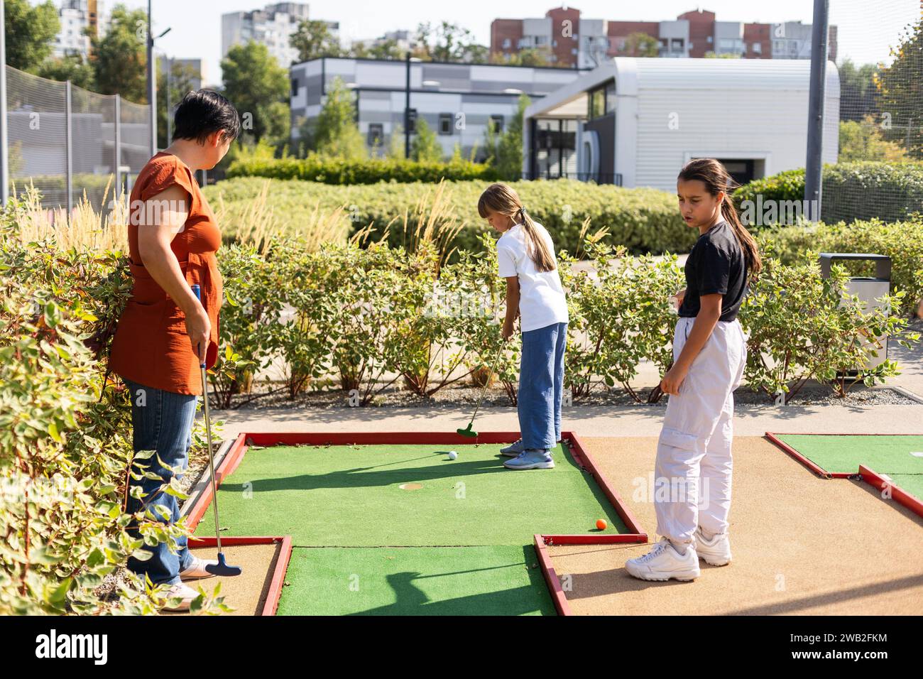 Cute boy playing golf hi-res stock photography and images - Alamy