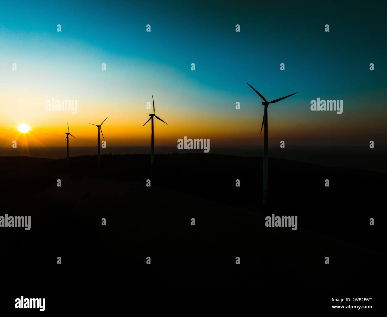 Aerial landscape photography of sunrise over nature with wind turbines ...