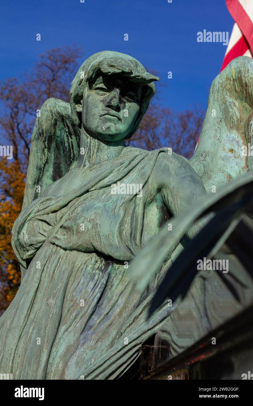 Angel statue grave overlooking cemetery Stock Photo - Alamy