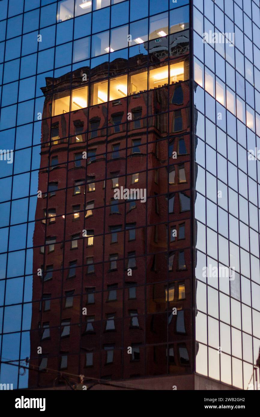 Reflection of building on windows Stock Photo - Alamy