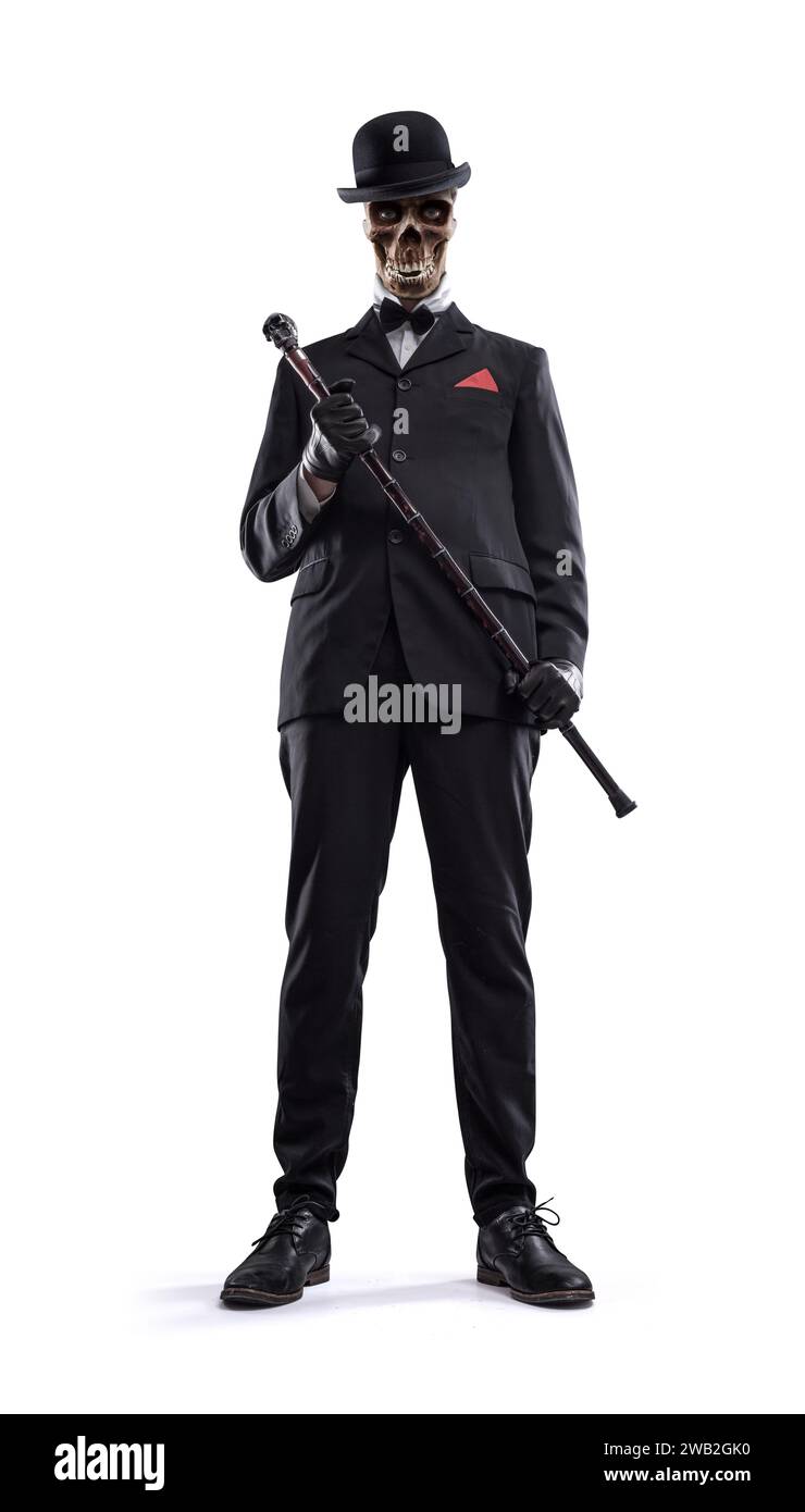 Spooky Halloween monster with skull head, he is holding a walking stick ...