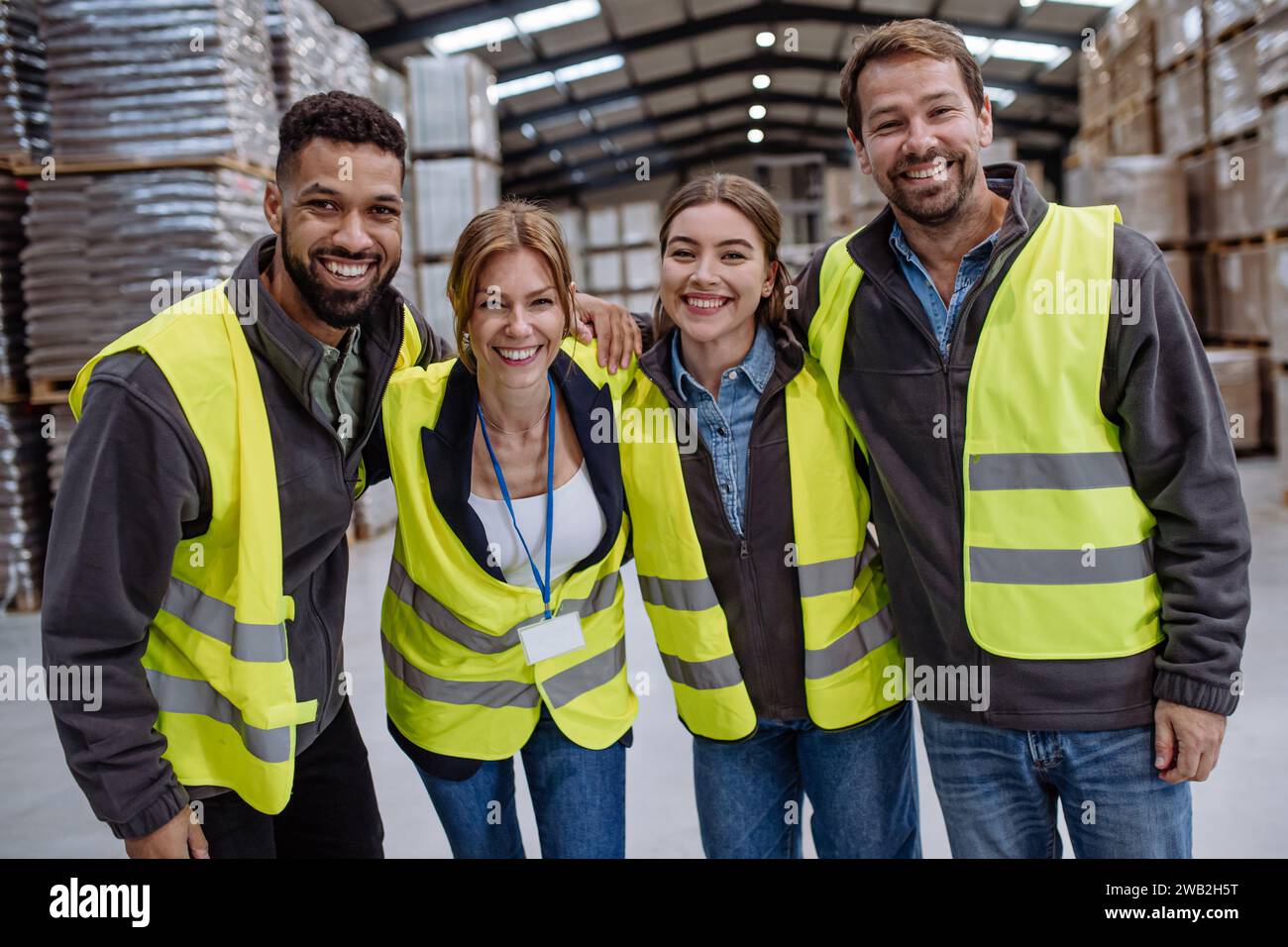 Full team of warehouse employees standing in warehouse. Team of workers ...