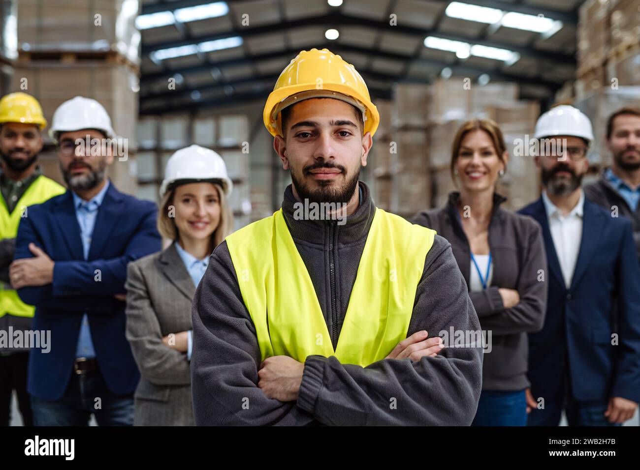 Full team of warehouse employees standing in warehouse. Team of workers ...