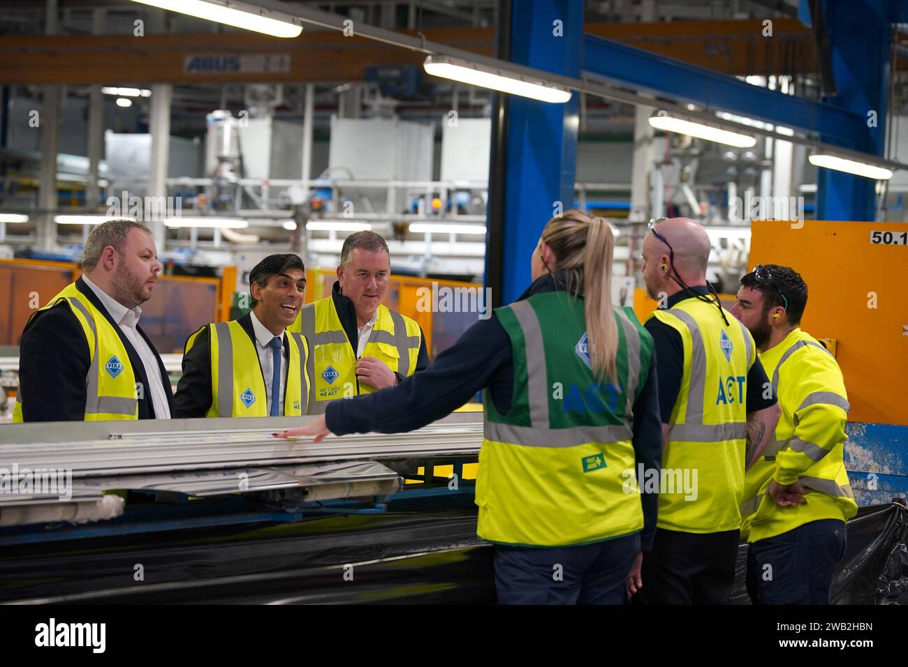 Prime Minister Rishi Sunak (2nd left) with Neil Evans Managing Director ...