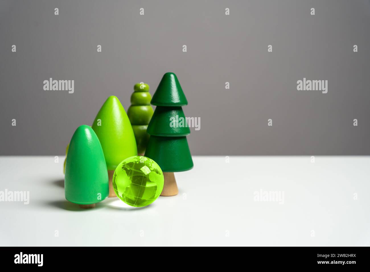 Green globe planet earth surrounded by forest trees. Environmental ... Green globe planet earth surrounded by forest trees. Environmental ...