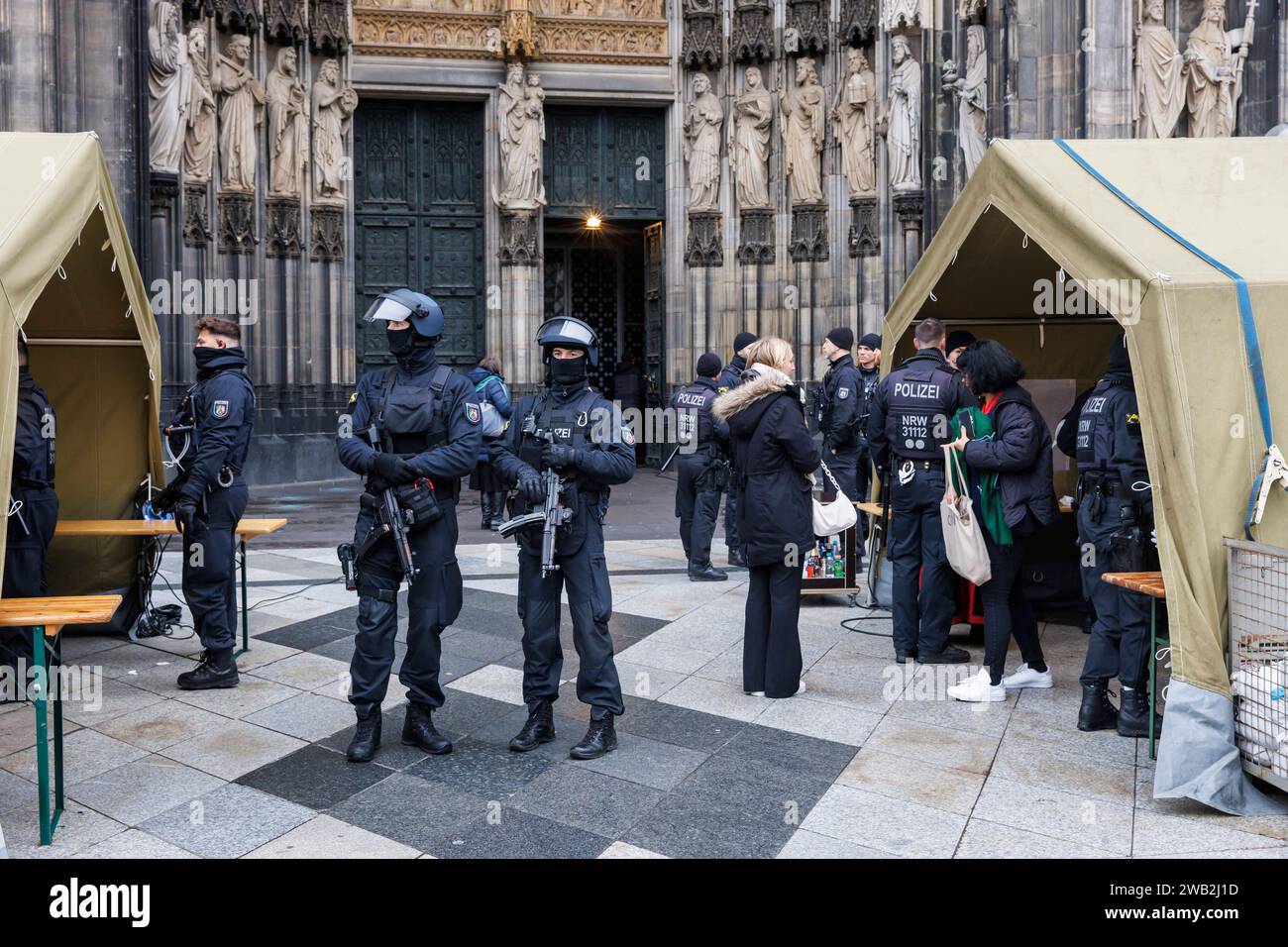 due to a terror warning, visitors to Cologne Cathedral are strip-searched before entering ...