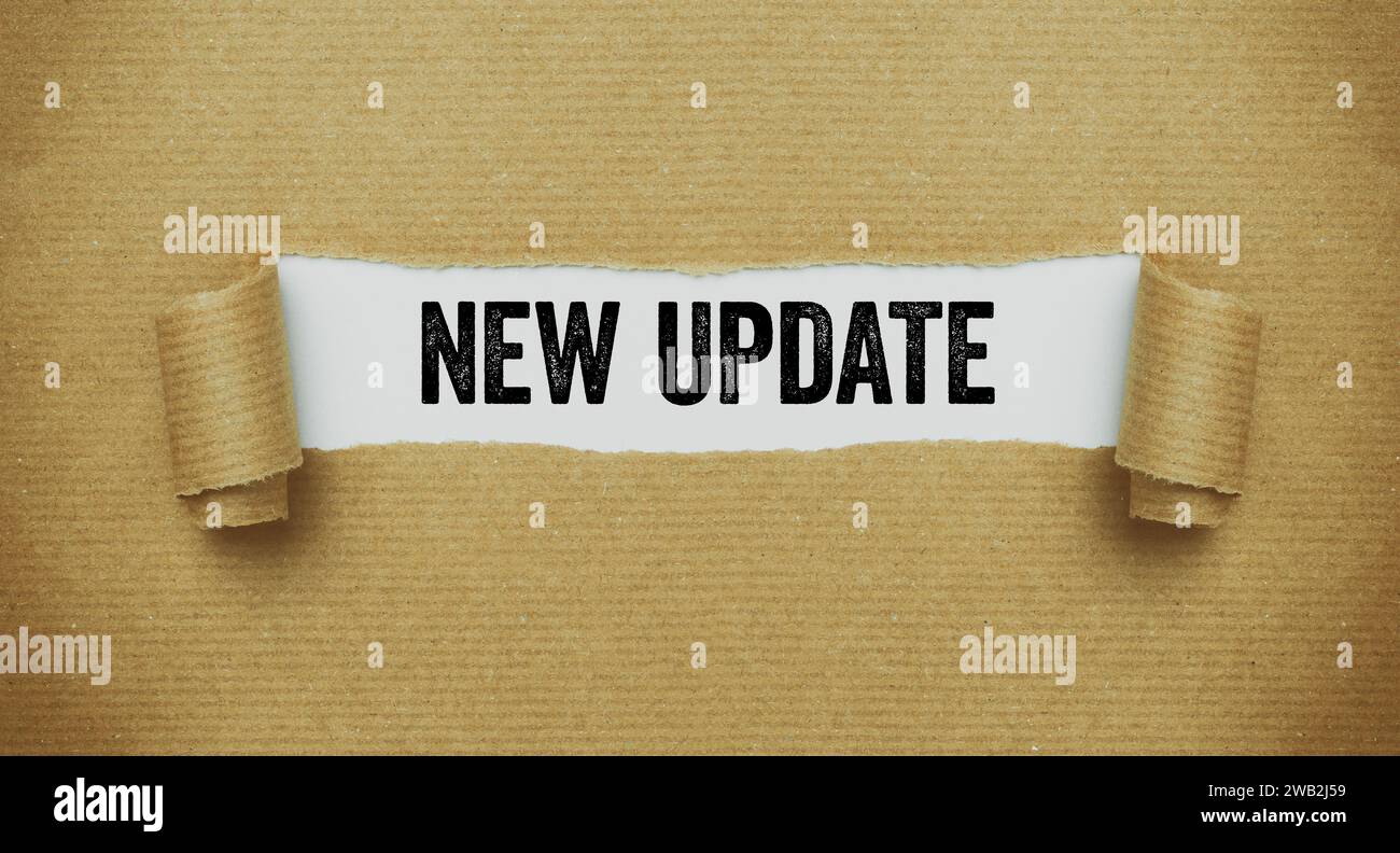 Torn paper revealing the words New Update Stock Photo - Alamy
