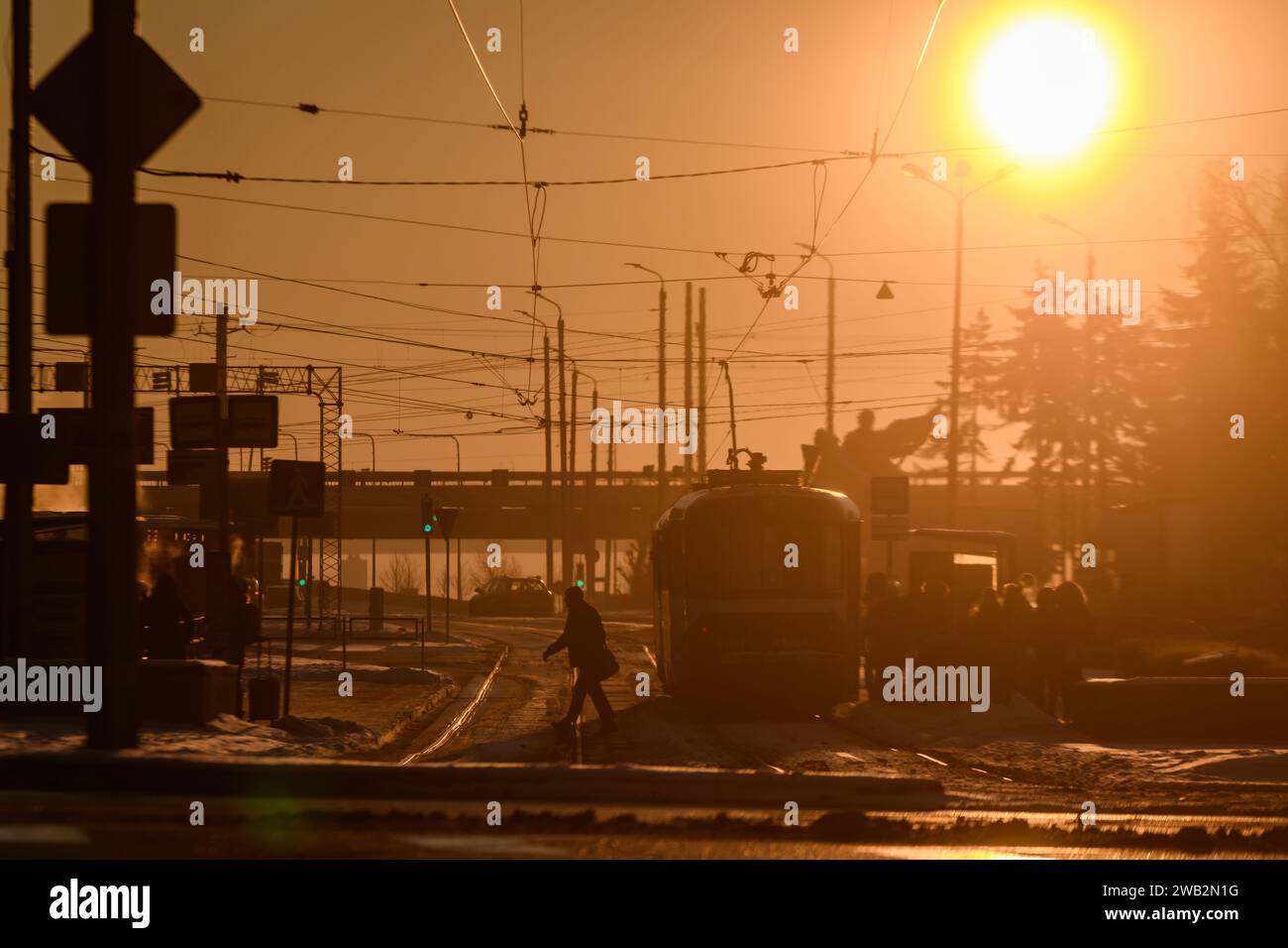 RIGA, Latvia. 8th Jan, 2024. Selective focus photo. A man crossing tram ...